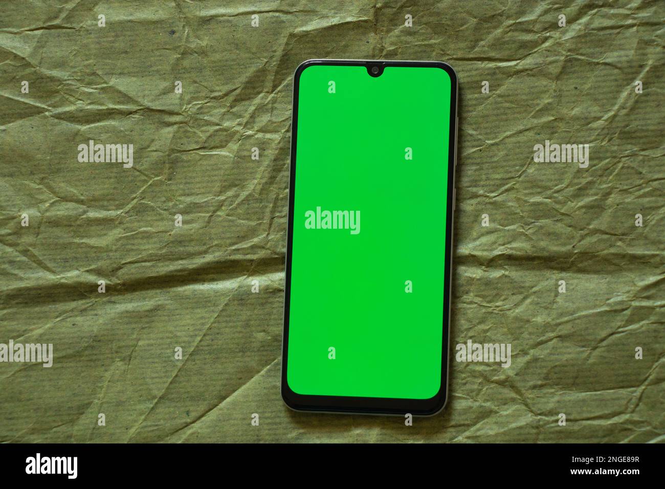 touchscreen phone with a green screen on a light background Stock Photo ...