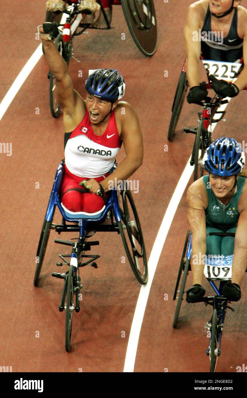 Chantal Petitclerc, of Canda, reacts after winning the gold in the 800 ...