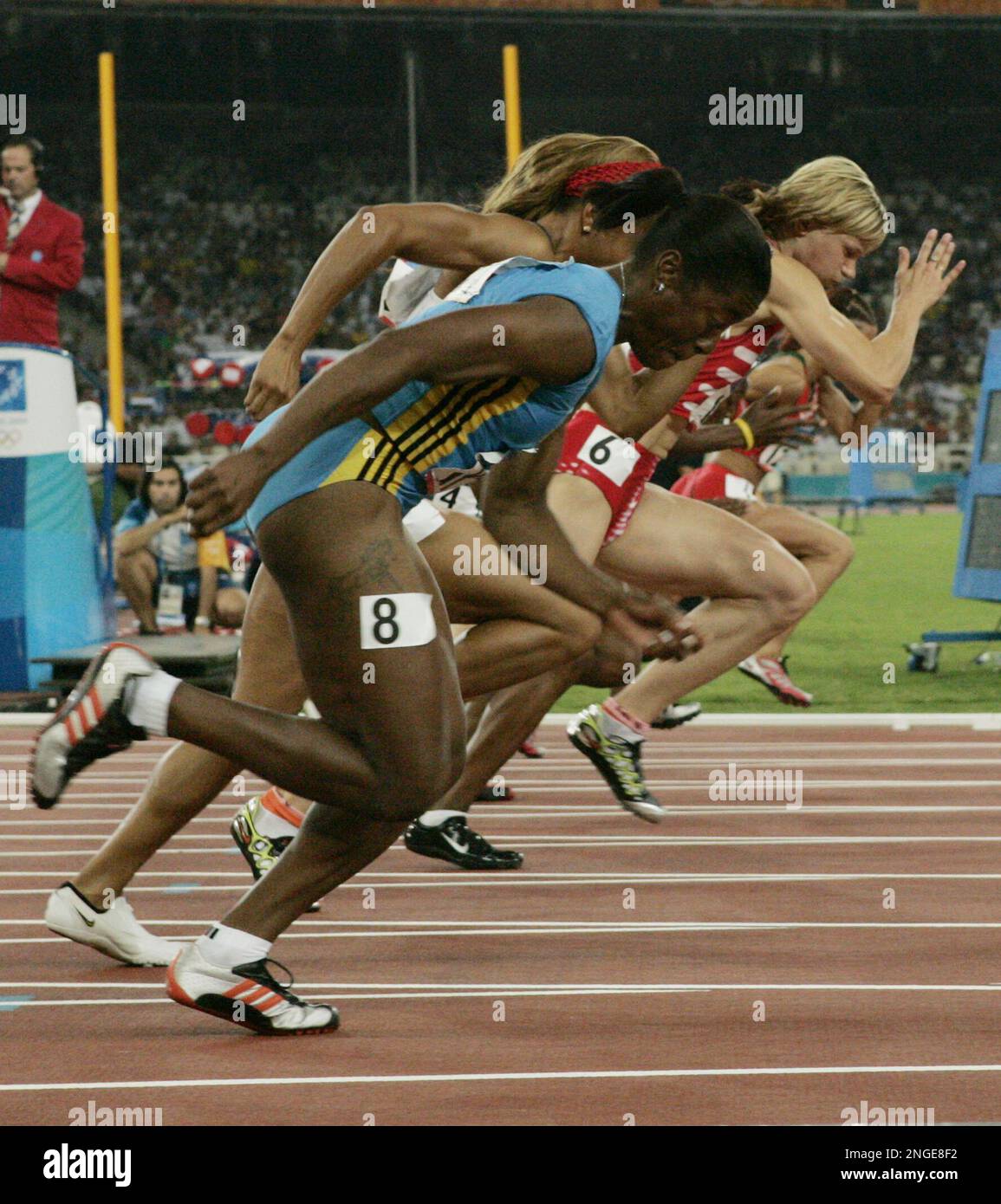 Yuliya Nesterenko, of Belarus, right, bursts clear at the start on her ...