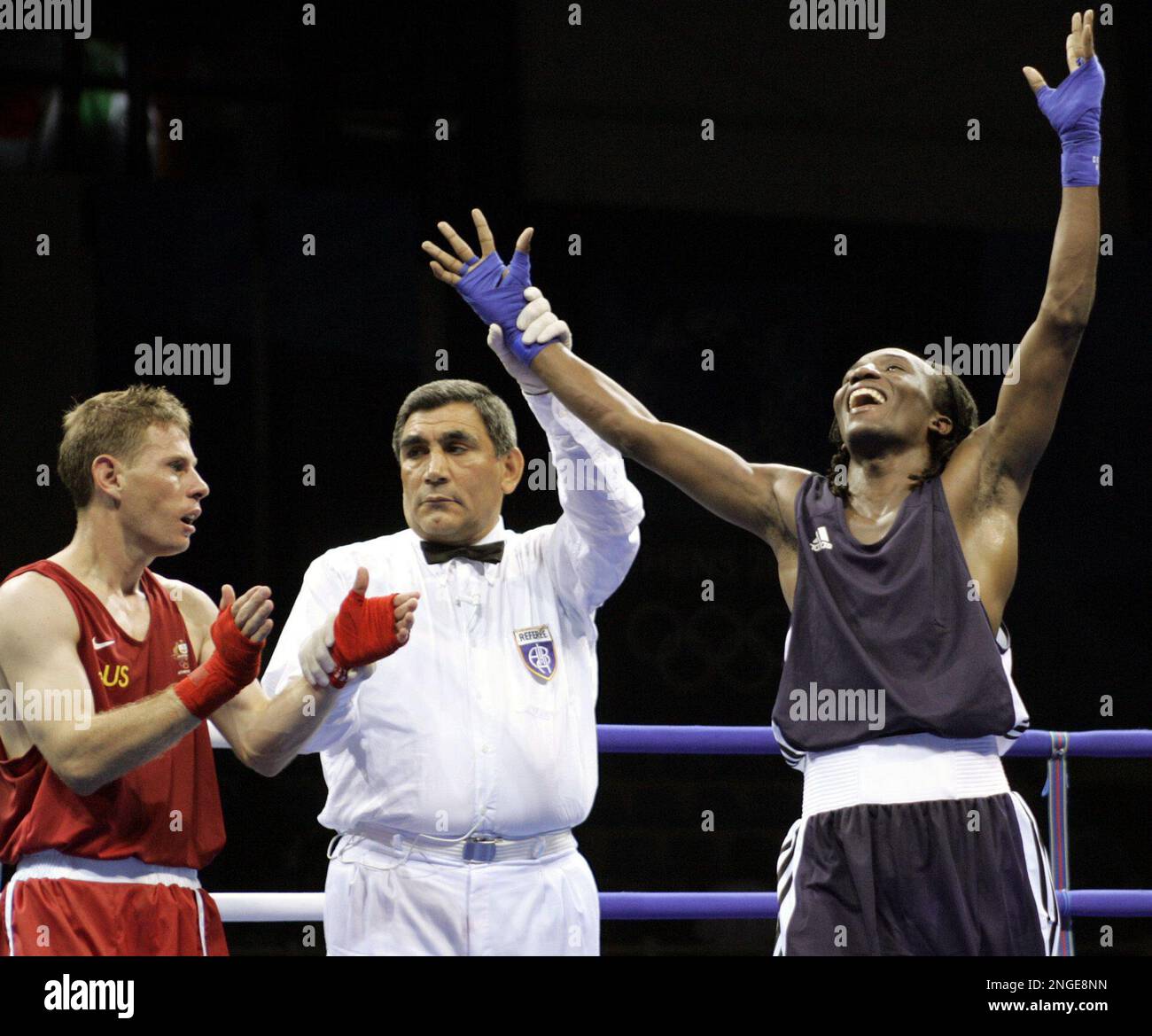 Namibia's Joseph Jermia, right, celebrates his victory as his opponent ...