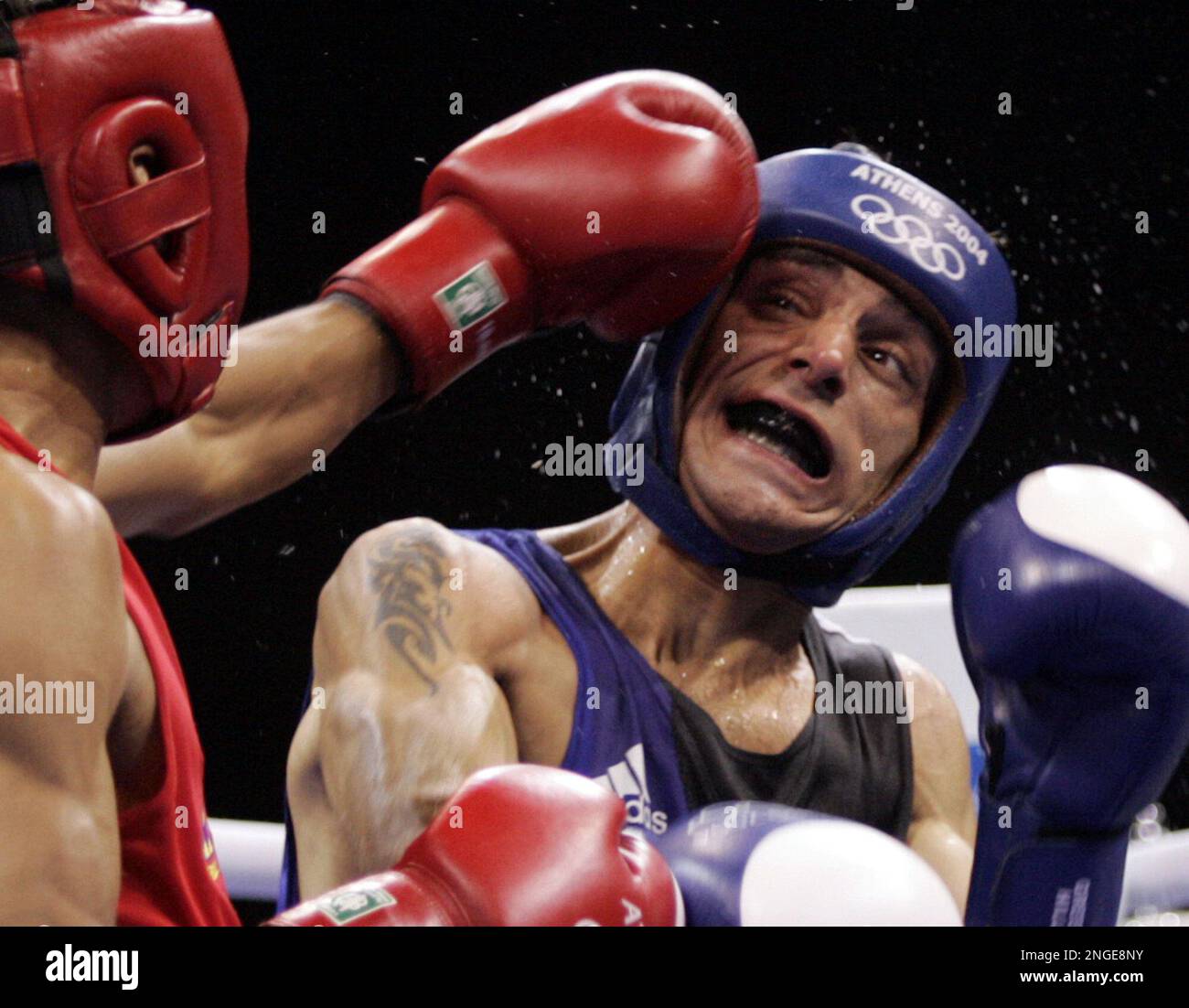 Colombia's Carlos Jose Tamara Paternina, left, lands his left on Italy ...