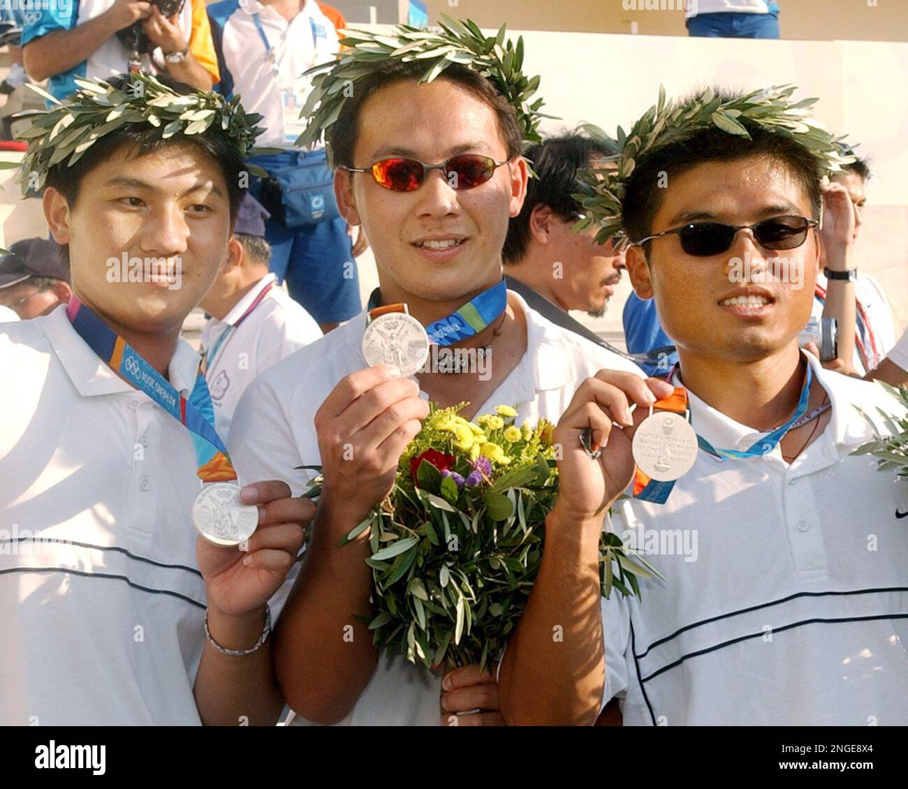 Taiwan's Men's team archers Wang Cheng Pang, left, Liu Ming Huang ...