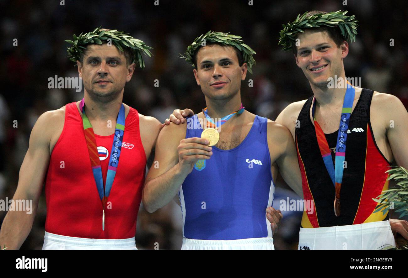 Silver medal winner Alexander Moskalenko of Russia, left, gold medal winner Yuri Nikitin of the ...