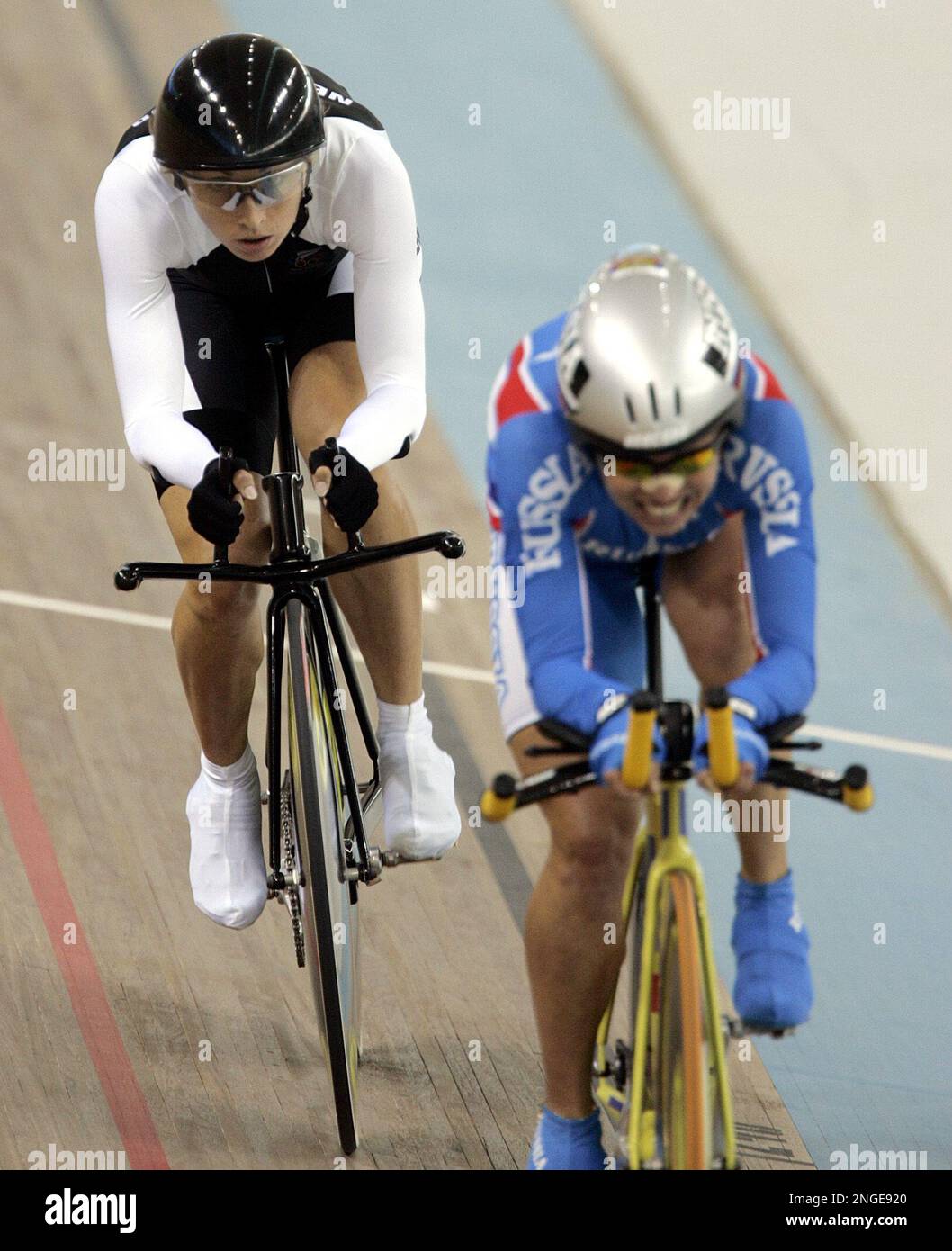 New Zealand's Sarah Ulmer, left, is about to lap Russia's Olga ...