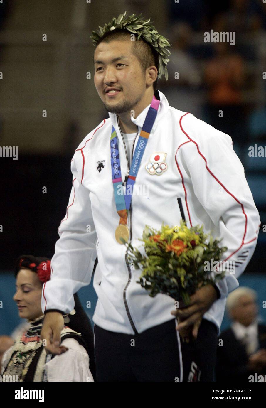 Japan's Keiji Suzuki receives the gold medal in the Men's Heavy Judo at ...