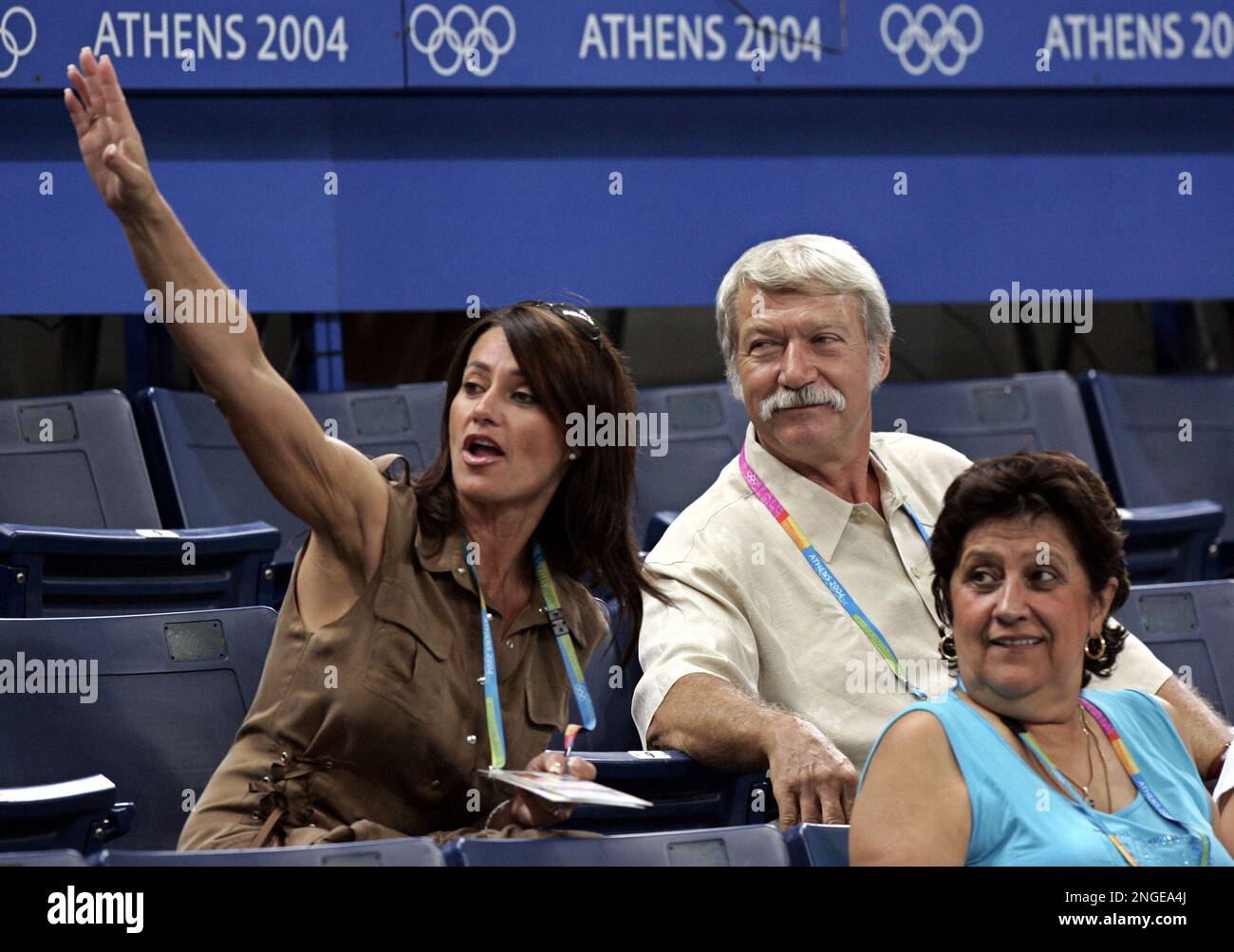 Former Romanian coach Bela Karolyi, center, and former Romanian gold ...