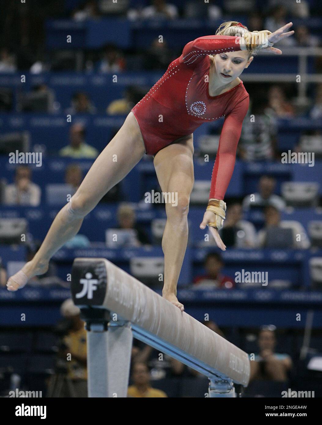 Courtney Kupets, of the United States, loses her balance during her ...