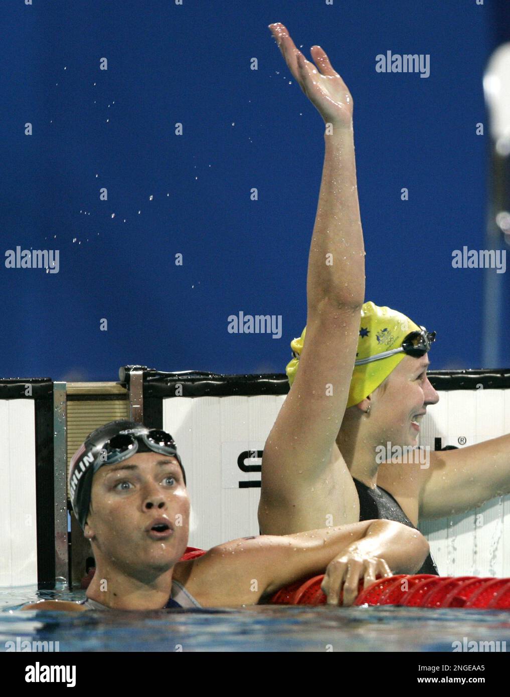 Natalie Coughlin, of the United States, left, looks on as gold medal ...