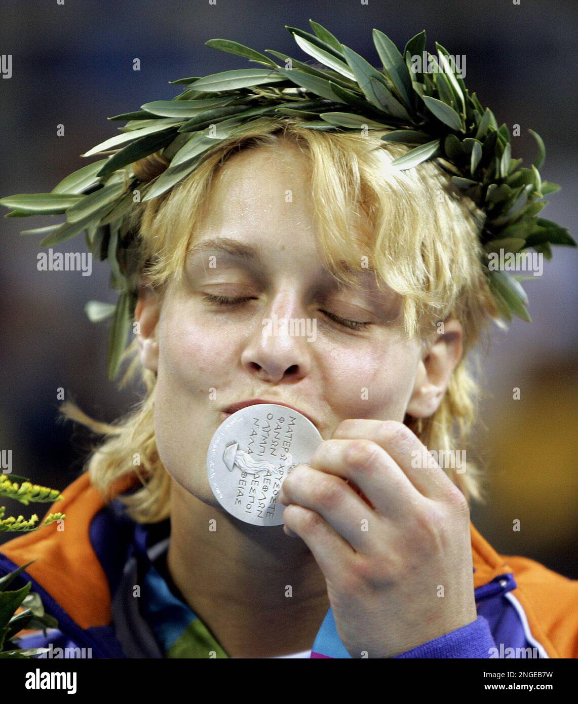 Edith Bosch from Netherlands, bites the silver medal she won for the ...