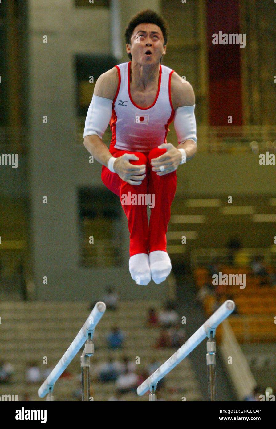 Japan's Takehiro Kashima competes on the parallel bars during the men's ...