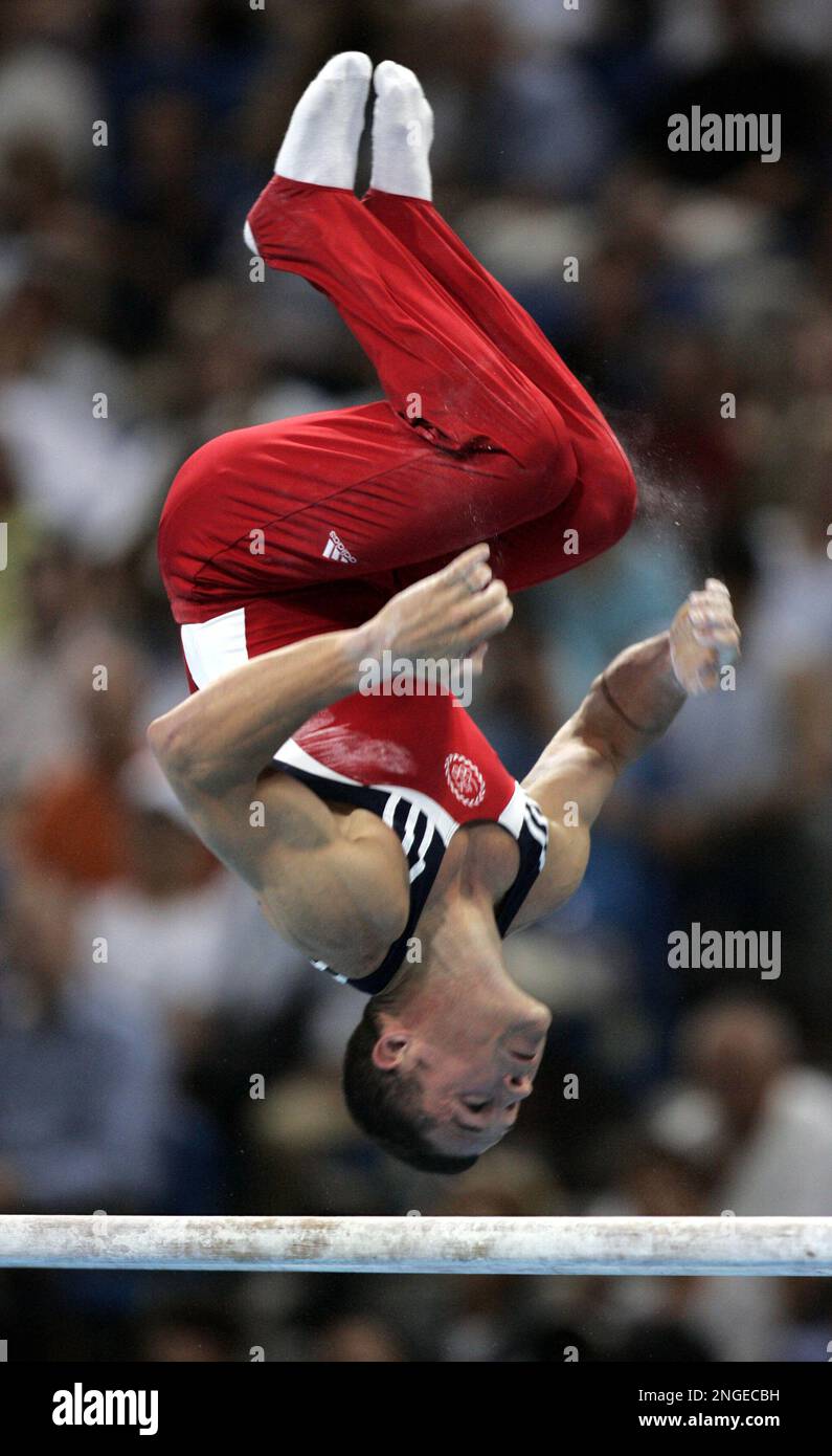Blaine Wilson of the United States competes in the parallel bars during ...