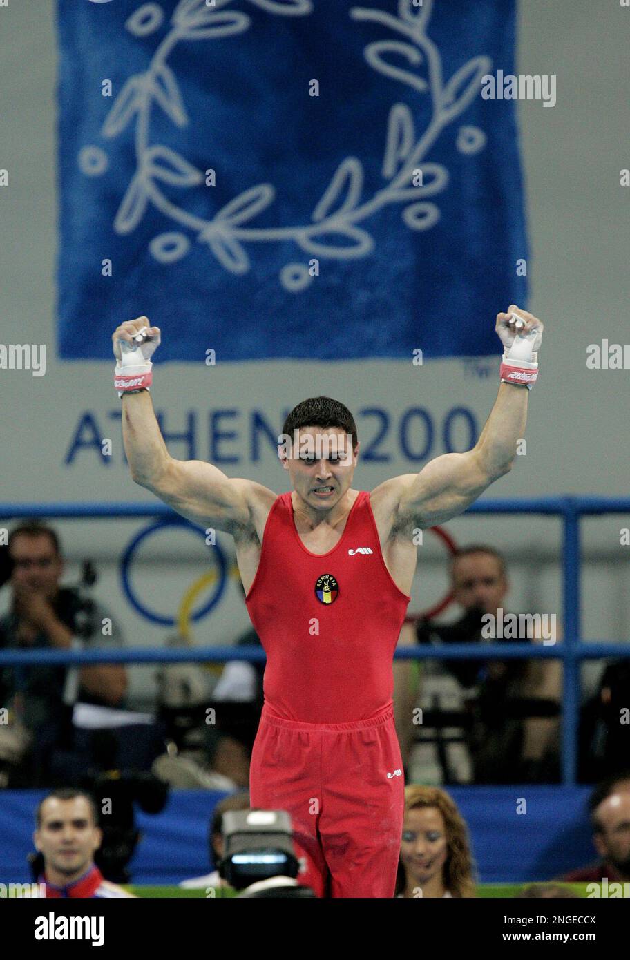 Romania's Razvan Dorin Selariu reacts to his performance on the rings ...