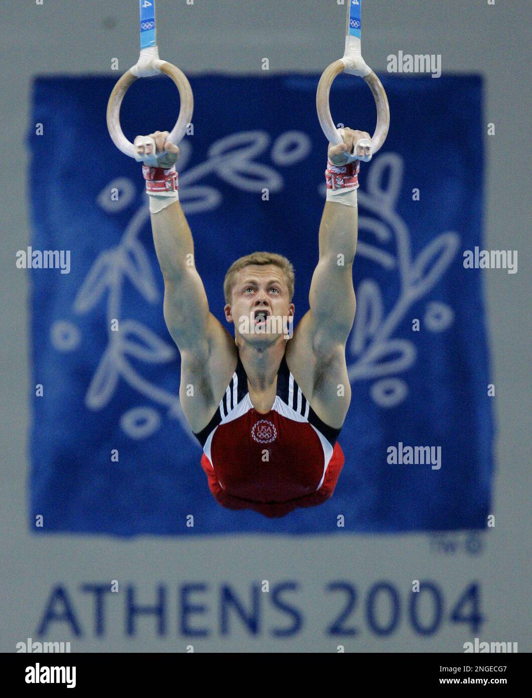 Guard Young, of the United States, performs his routine on the rings ...