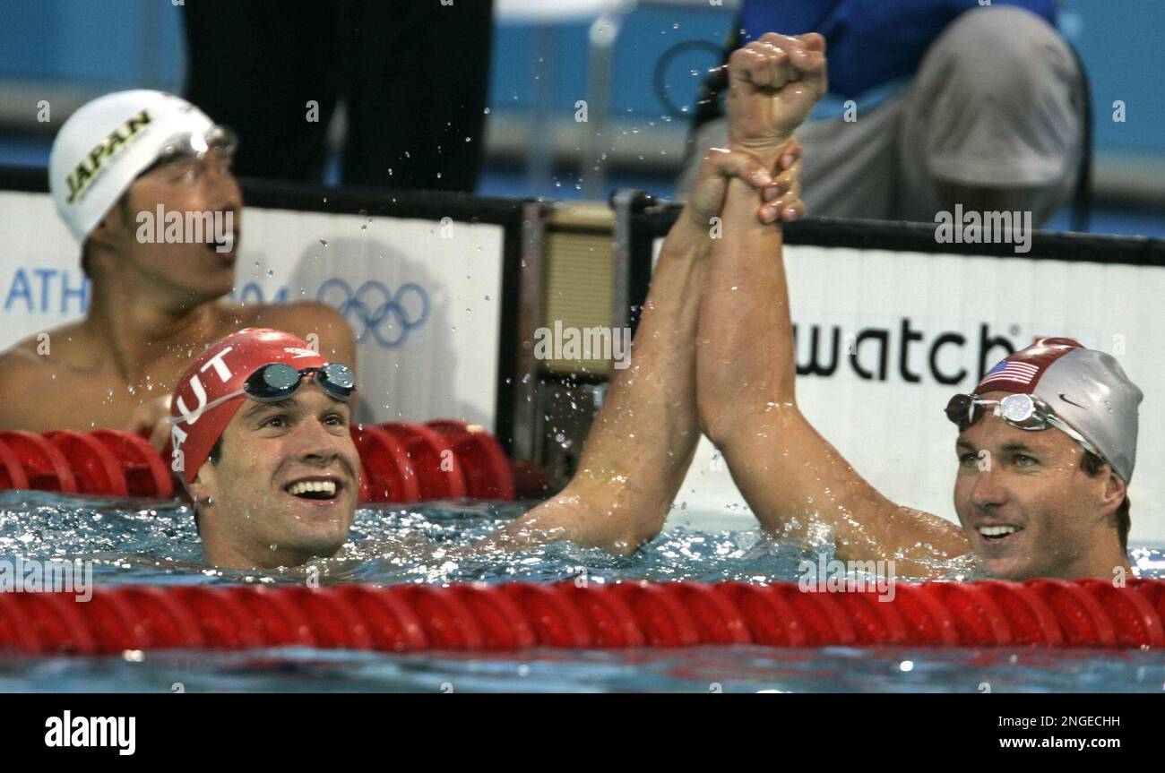 Aaron Peirsol, of the United States, is congratulated by Austria's ...