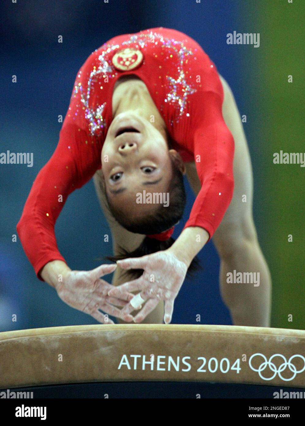 Lin Li of China competes in the vault during the women's gymnastics ...