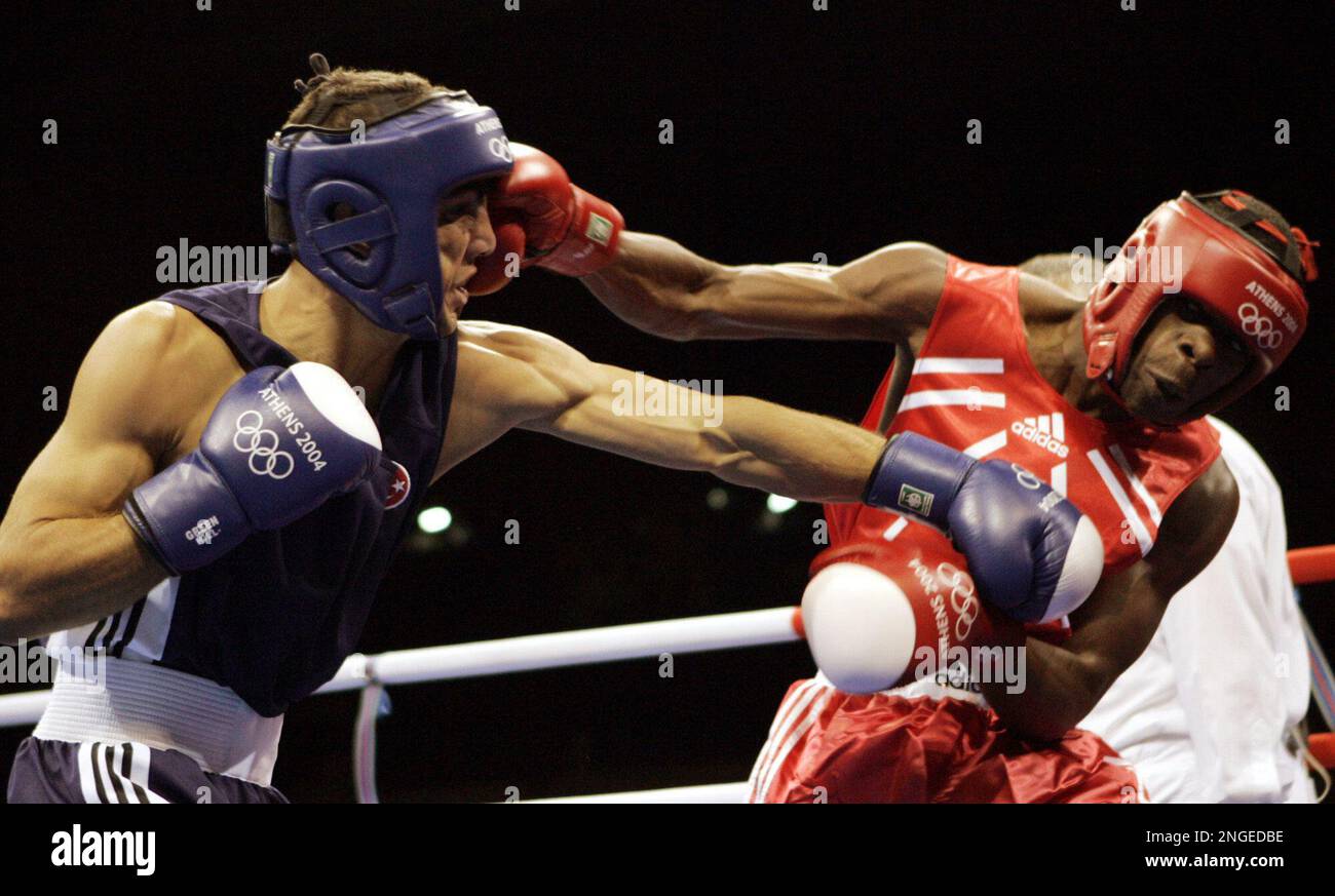 Turkey's Bulent Ulusoy, left, and Zambia's Ellis Chibuye exchange ...