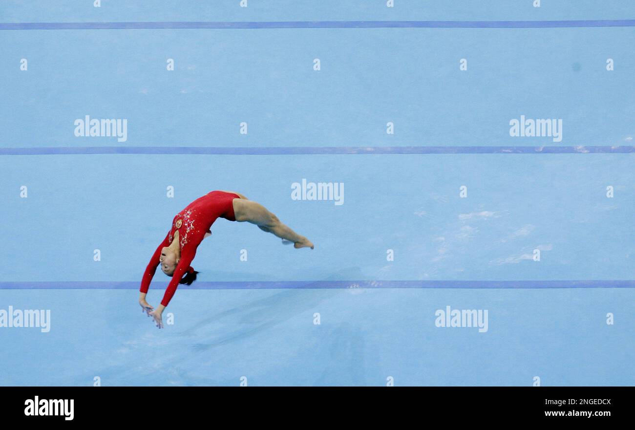 China's Lin Li is framed by the pattern of the floor as she performs ...