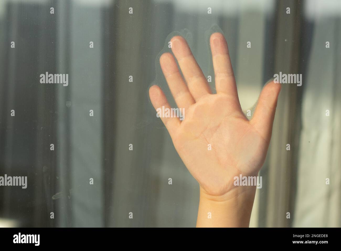 children's hand on glass window during self-isolation Stock Photo - Alamy