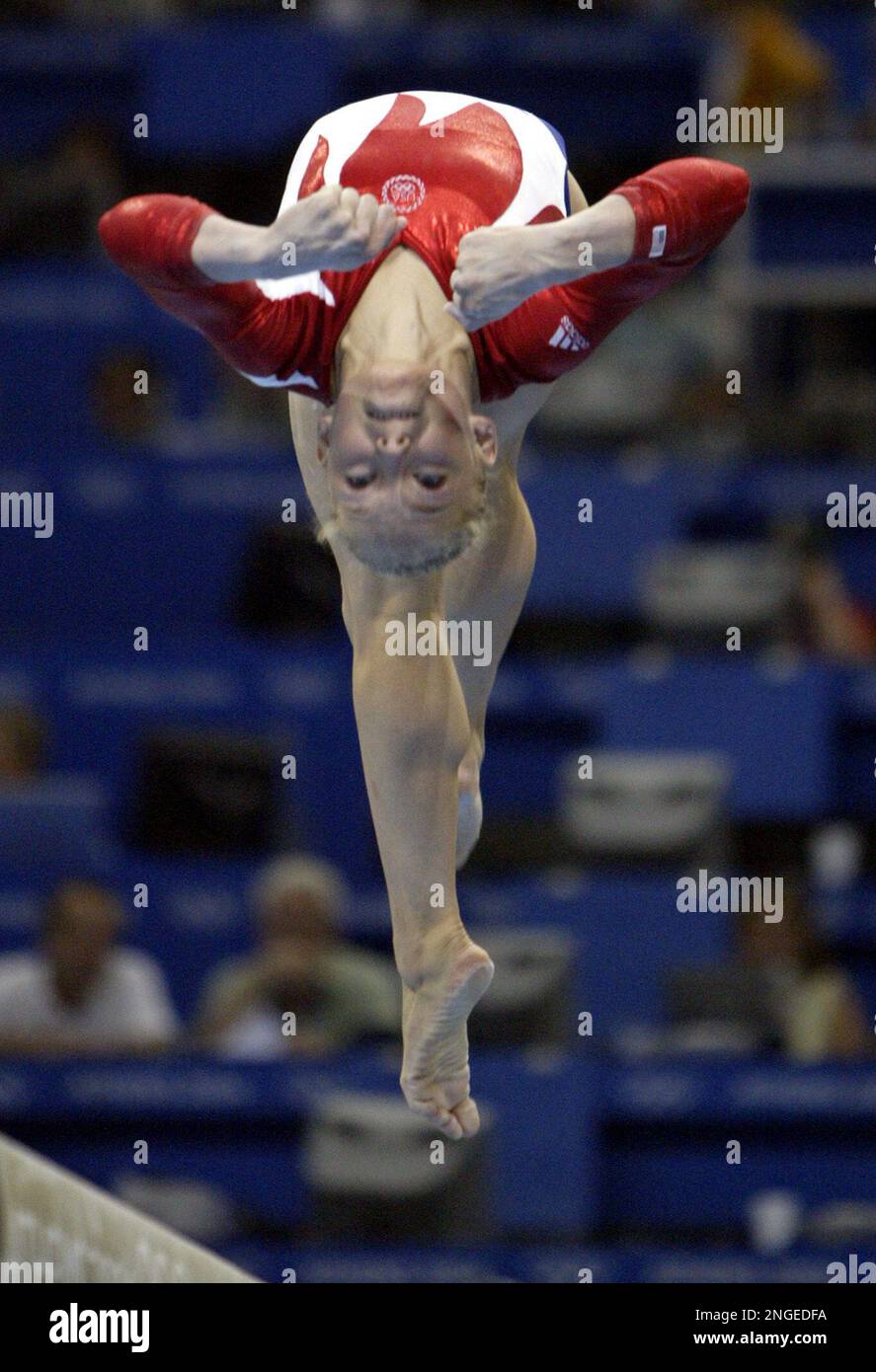 Courtney McCool of the United States competes in the balance beam ...