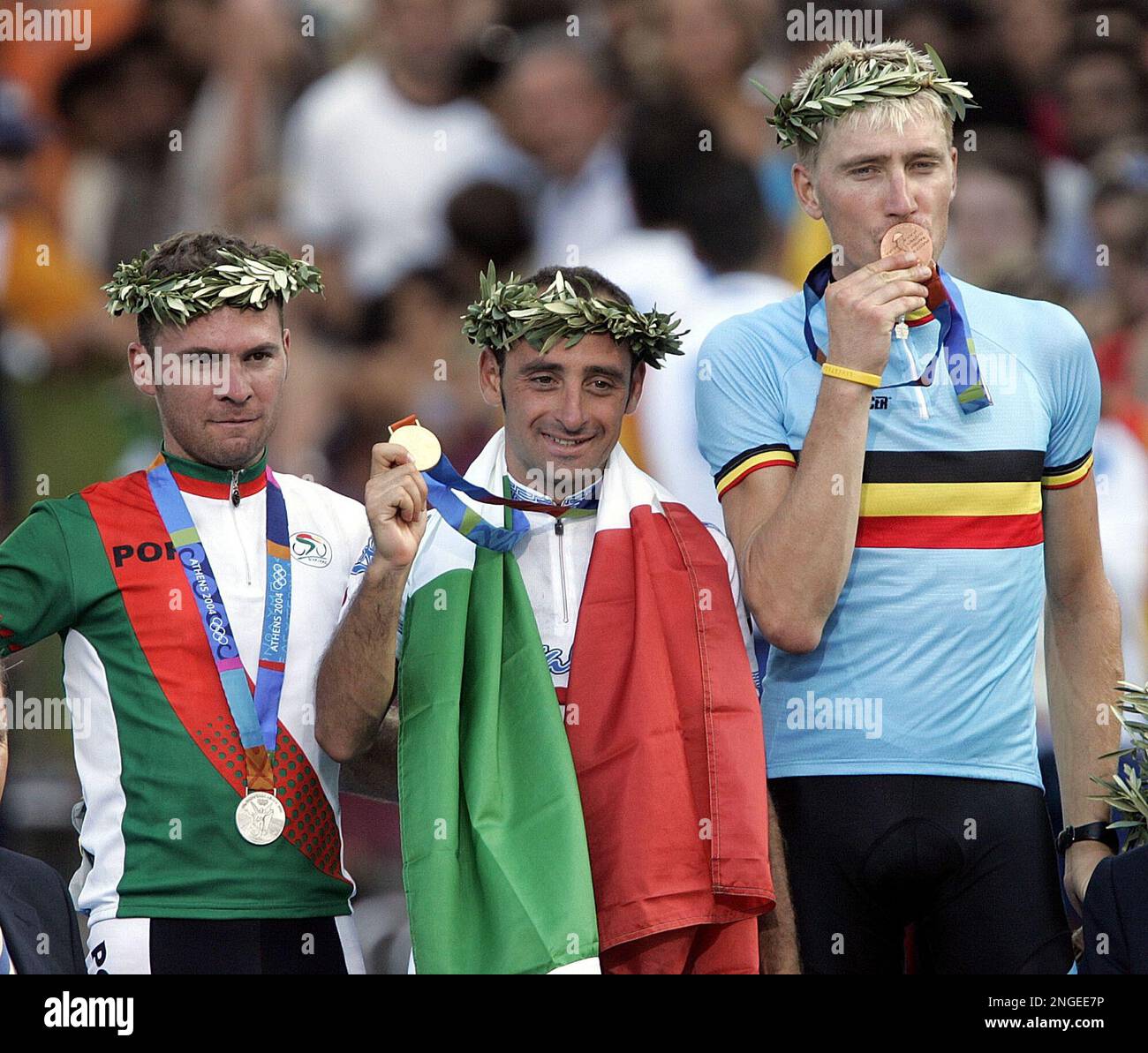 Italy's Paolo Bettini, center, the new Olympic champion, on podium with ...