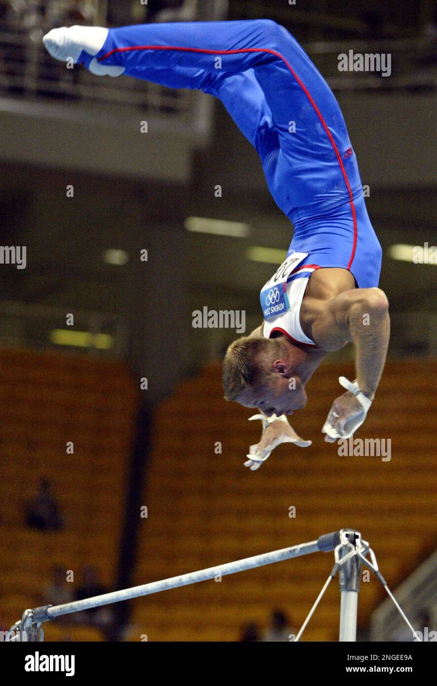 Alexei Nemov of Russia competes in the high bar during the men's ...