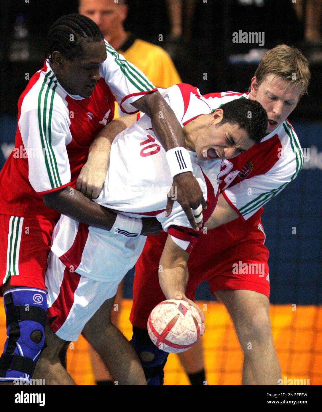 Egypt's Sherif Moemen, center, is stopped by Hungary's Ivo Diaz, left ...