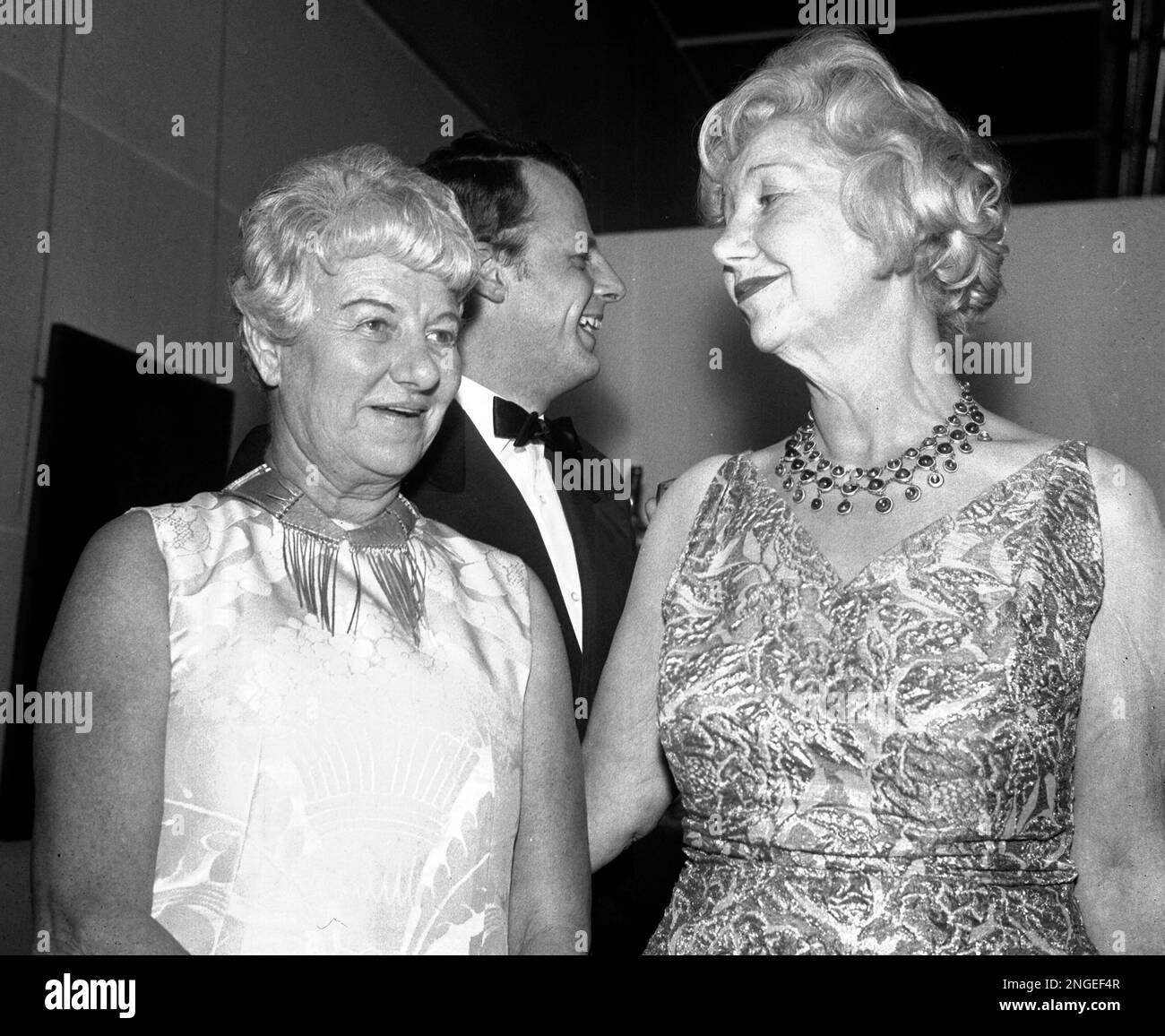 U.S. art collector Peggy Guggenheim, left, talks to her sister Hazel ...