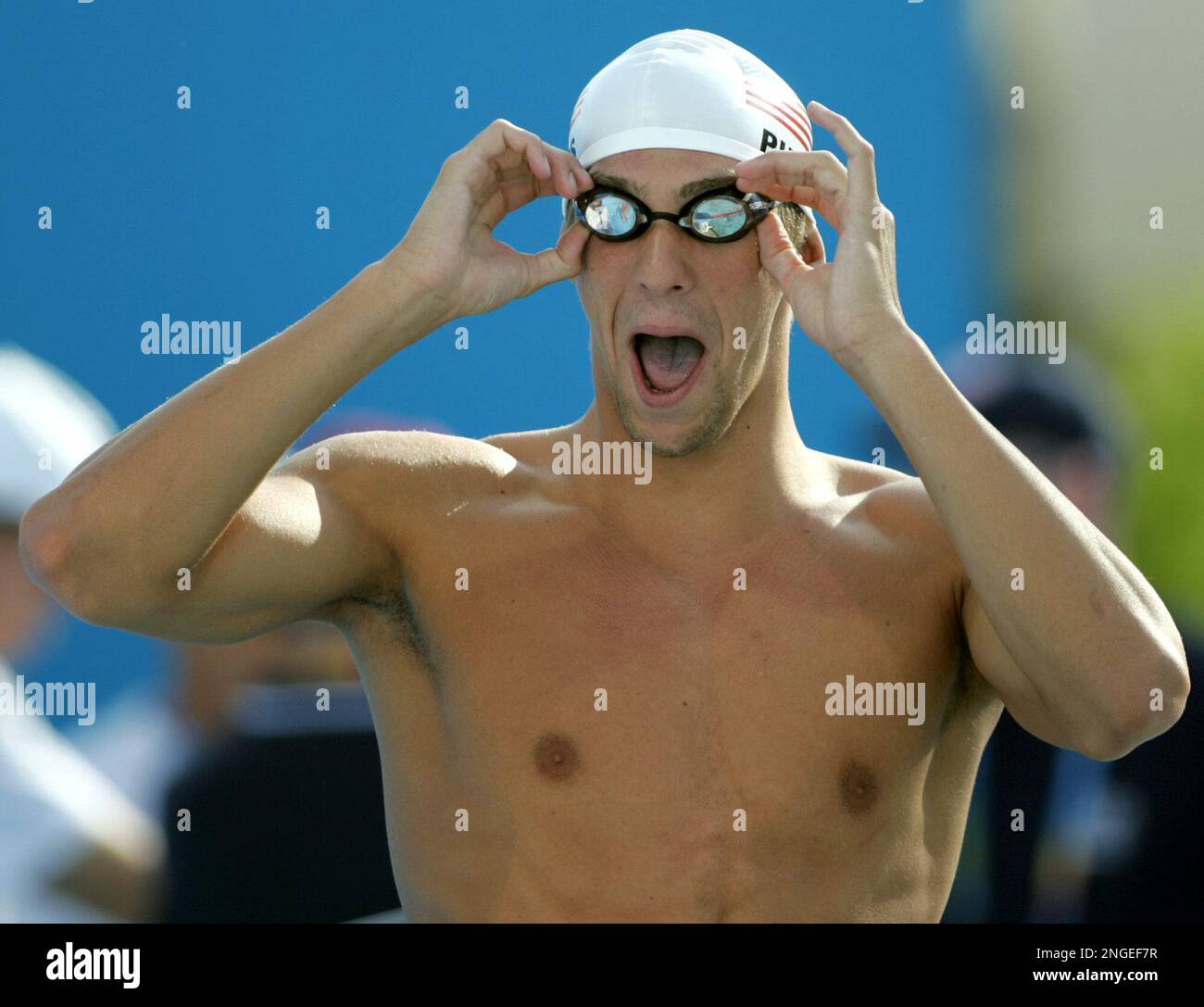 Michael Phelps, of the United States, adjusts his goggles during a ...