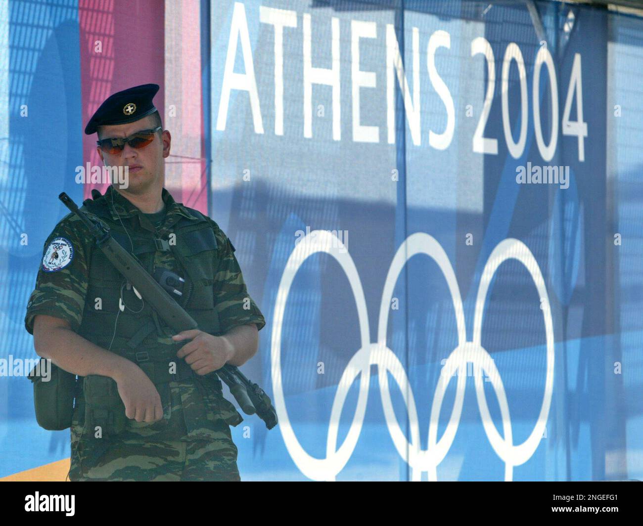 A Greek soldier stands guard at the Schinias Rowing & Canoeing Center ...