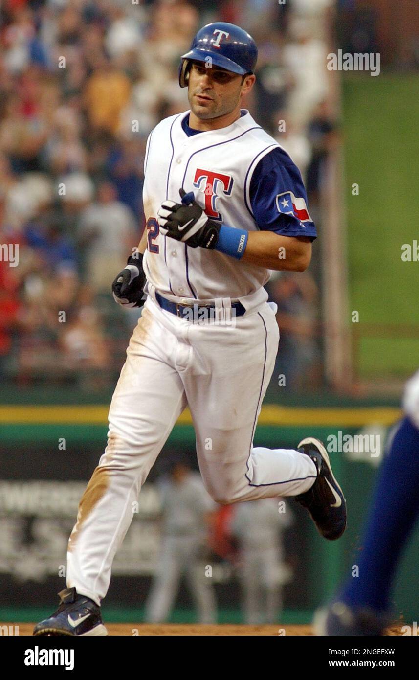 Texas Rangers' David Dellucci rounds the bases after hitting a two-run ...