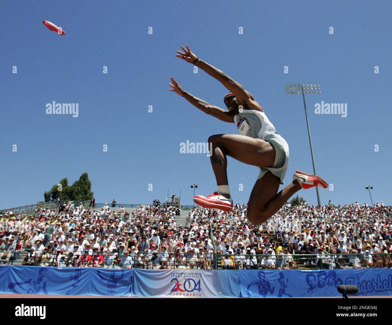 ** FILE ** Walter Davis jumps in the triple jump final during the ...