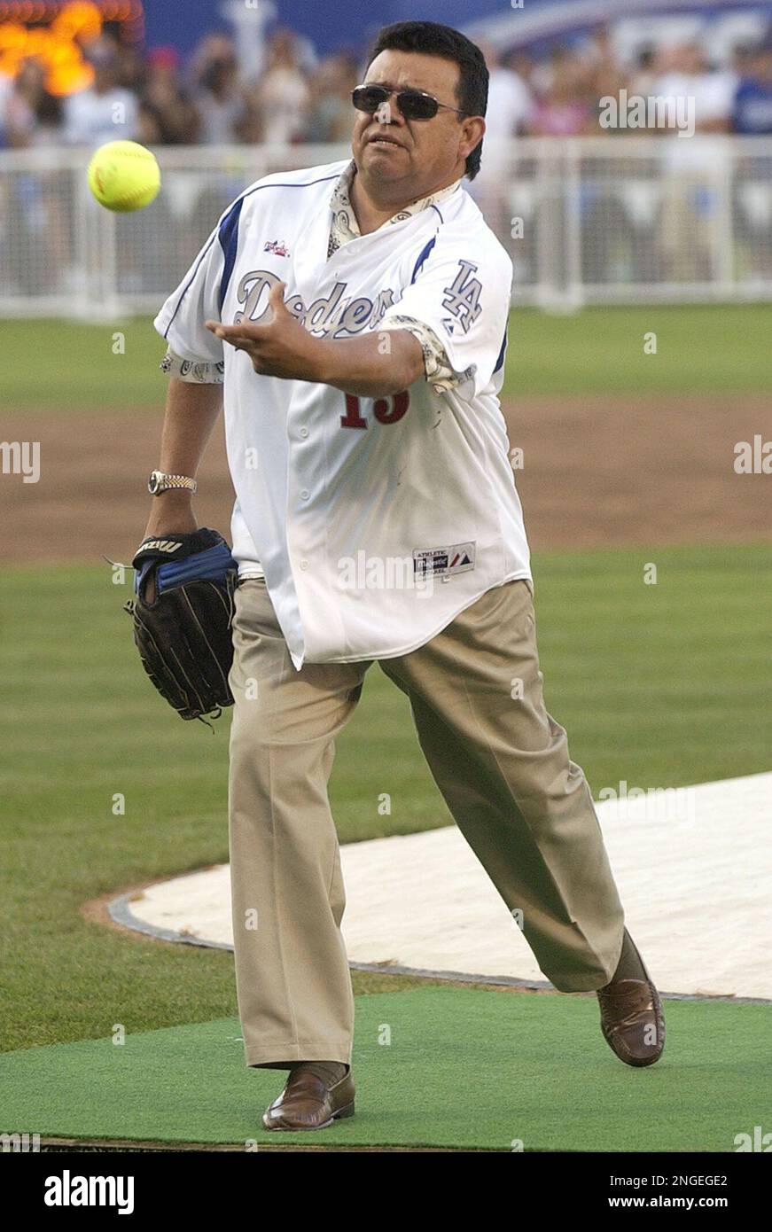 Former baseball player Fernando Valenzuela delivers a pitch in the ...