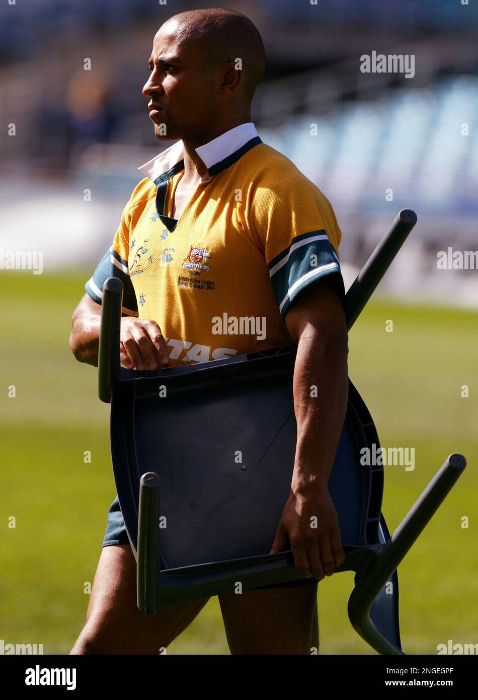 Australian rugby union captain George Gregan carries a chair from the ...