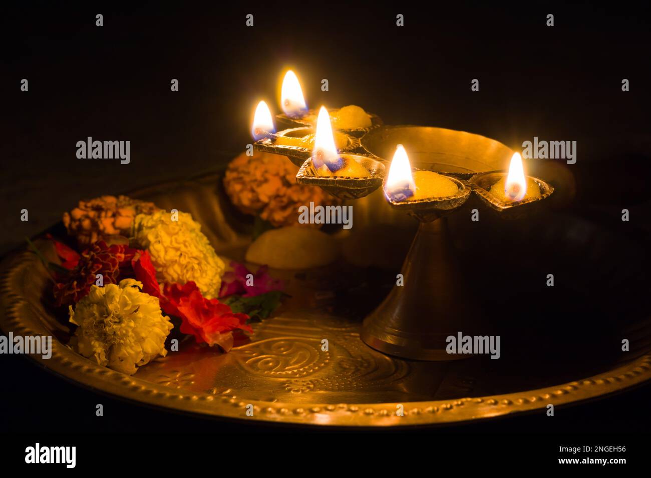 panch pradeep or five headed oil lamp burning with glowing flame with ...