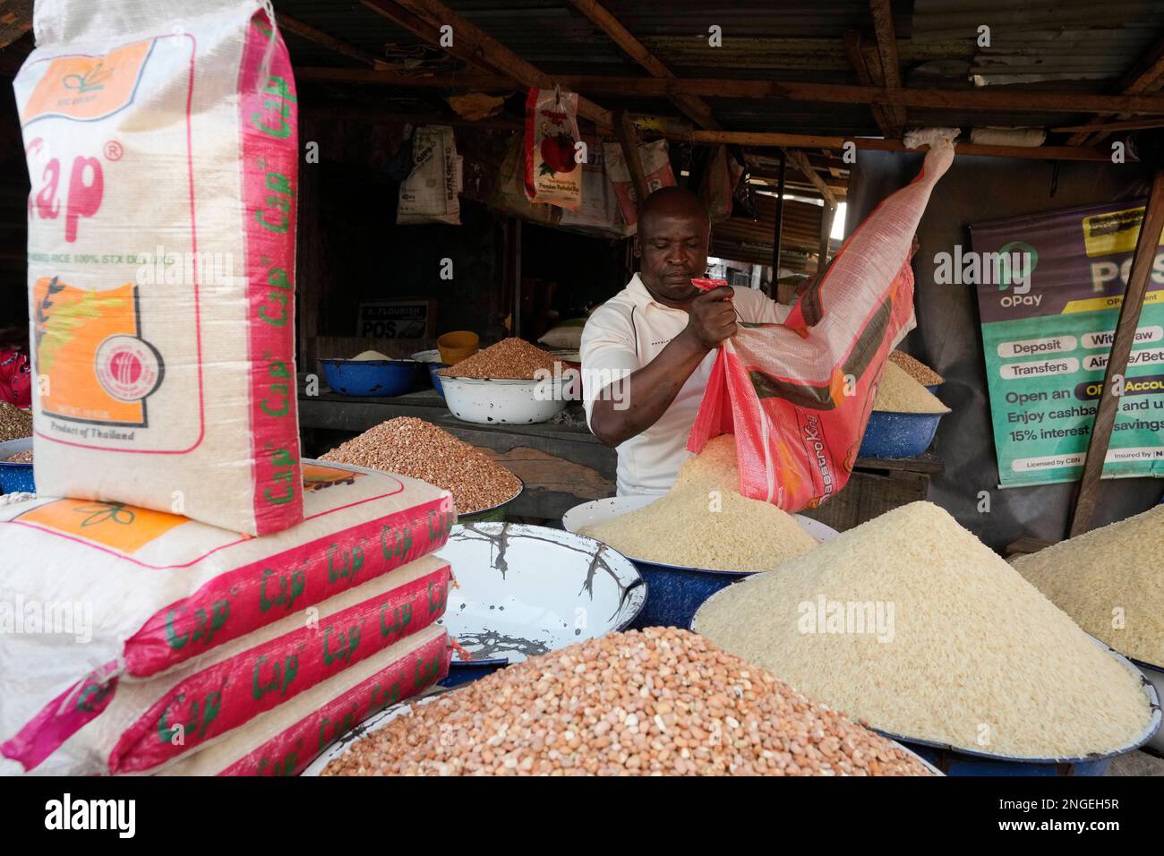 A man sells food at a market in Lagos, Nigeria, Tuesday, Feb. 7, 2023 ...