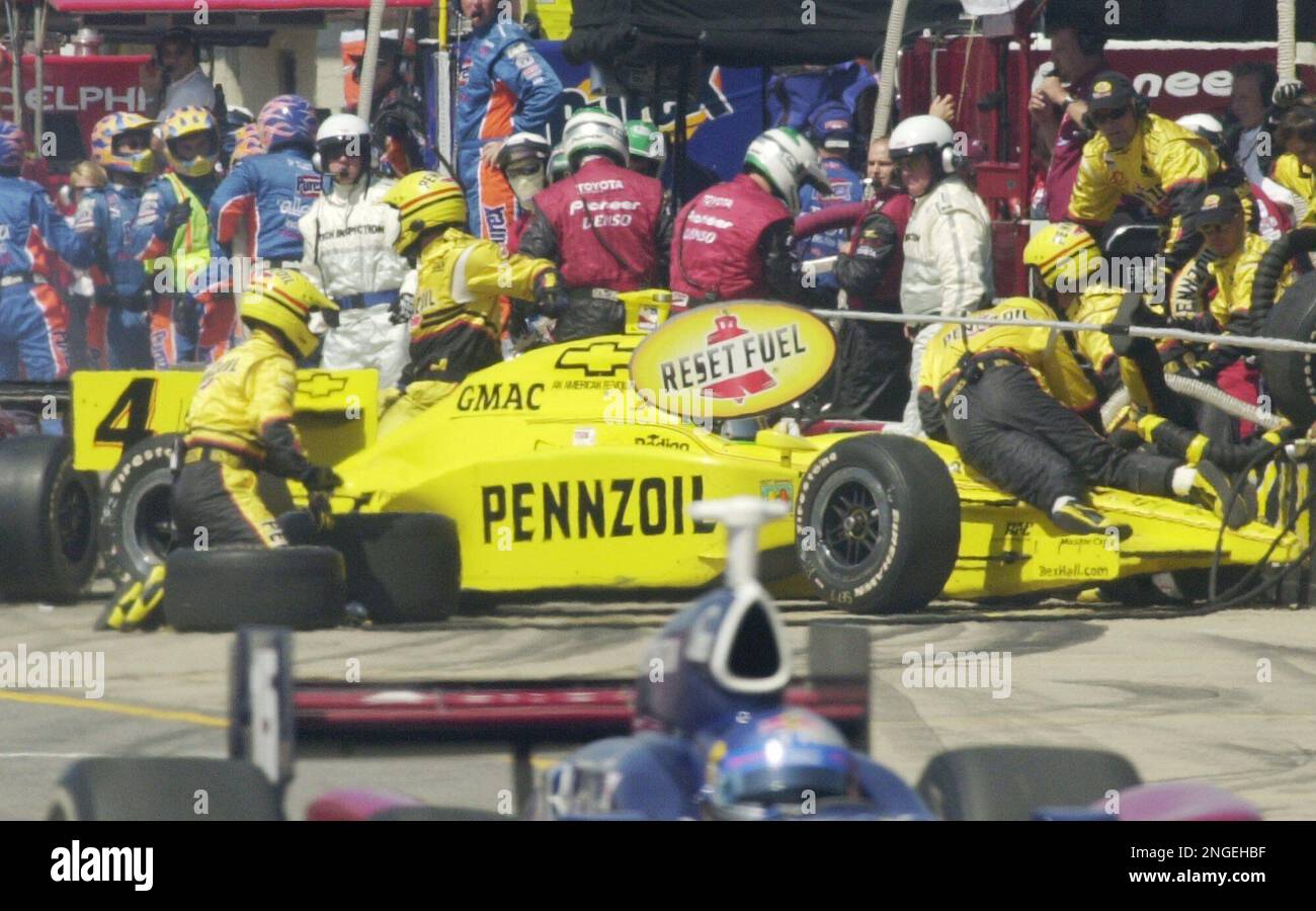 Steve Namisnak, a member of Tomas Scheckter's pit crew goes over the ...