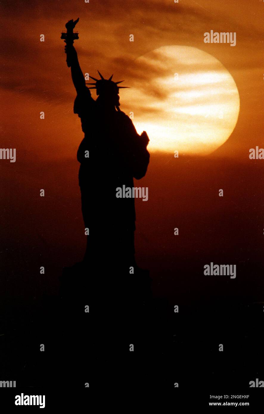 This is a July 4, 1986 photos of the sun setting behind the recently ...