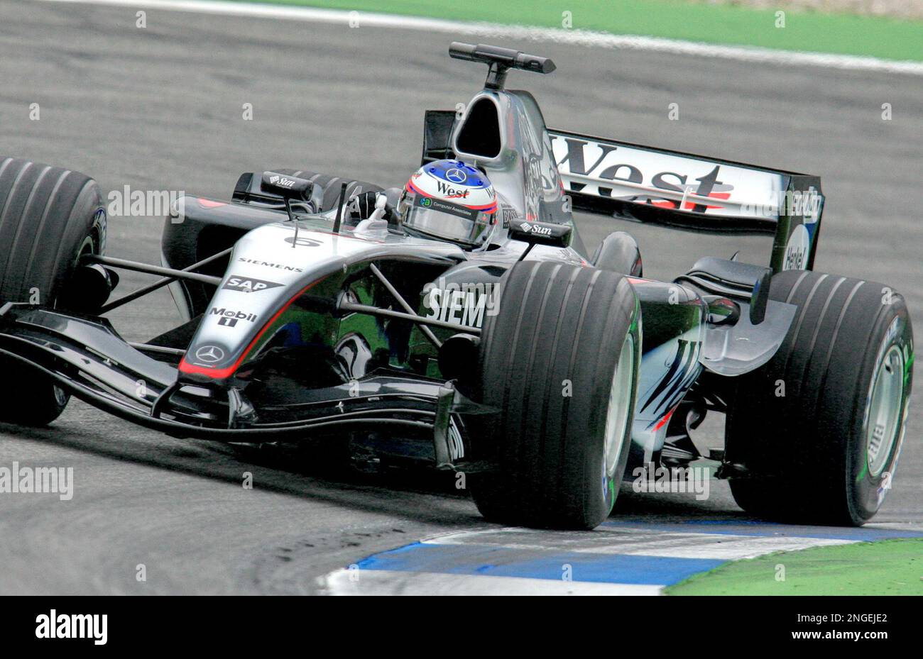 Finland's Formula 1 driver, Kimi Raikkonen, steers his McLaren Mercedes ...
