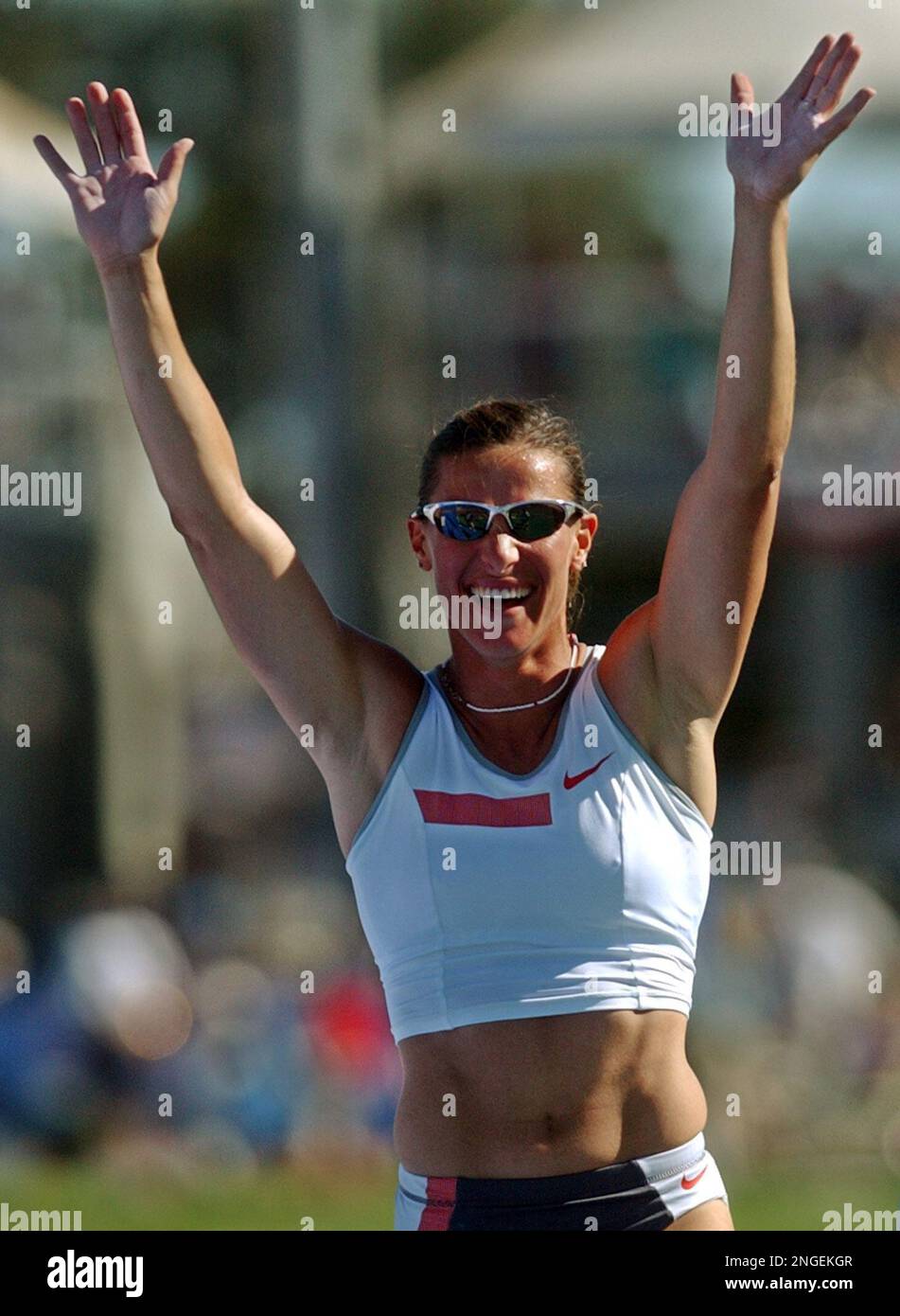 Stacy Dragila celebrates after finishing first in the pole vault during ...