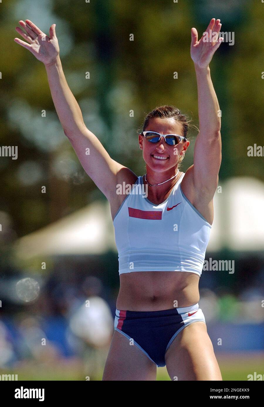 Stacy Dragila reacts after clearing the bar in the pole vault final ...