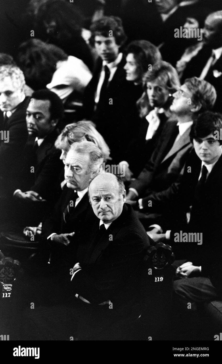 New York City Mayor Ed Koch, arms folded, attends the memorial service ...