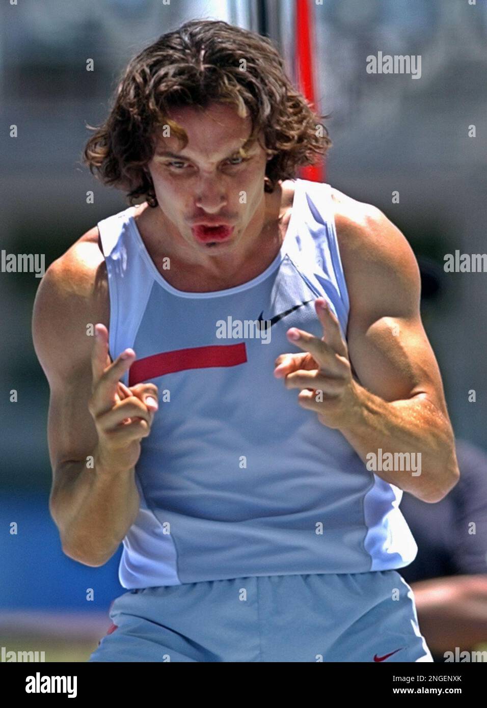 Toby Stevenson reacts after successfully clearing the bar during men's ...