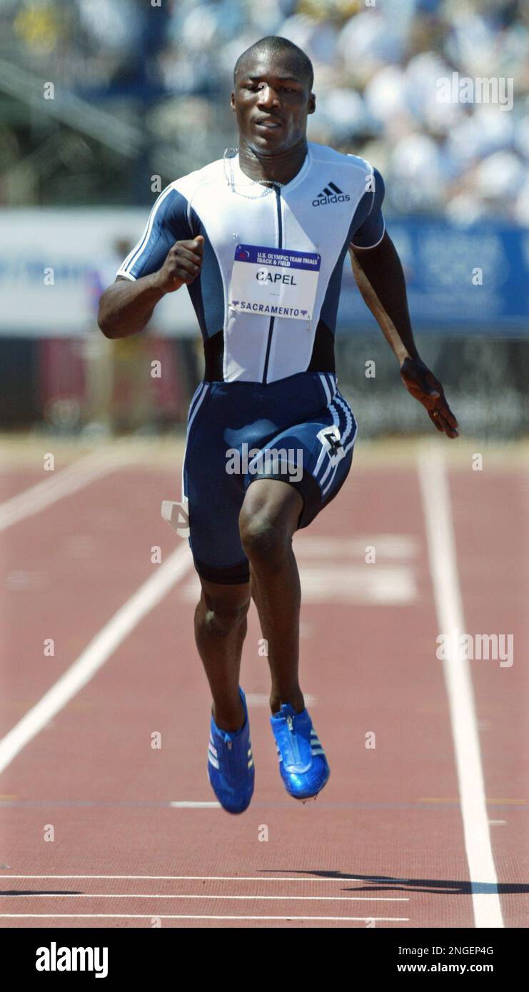 John Capel crosses the finish line during his qualifying heat in the ...