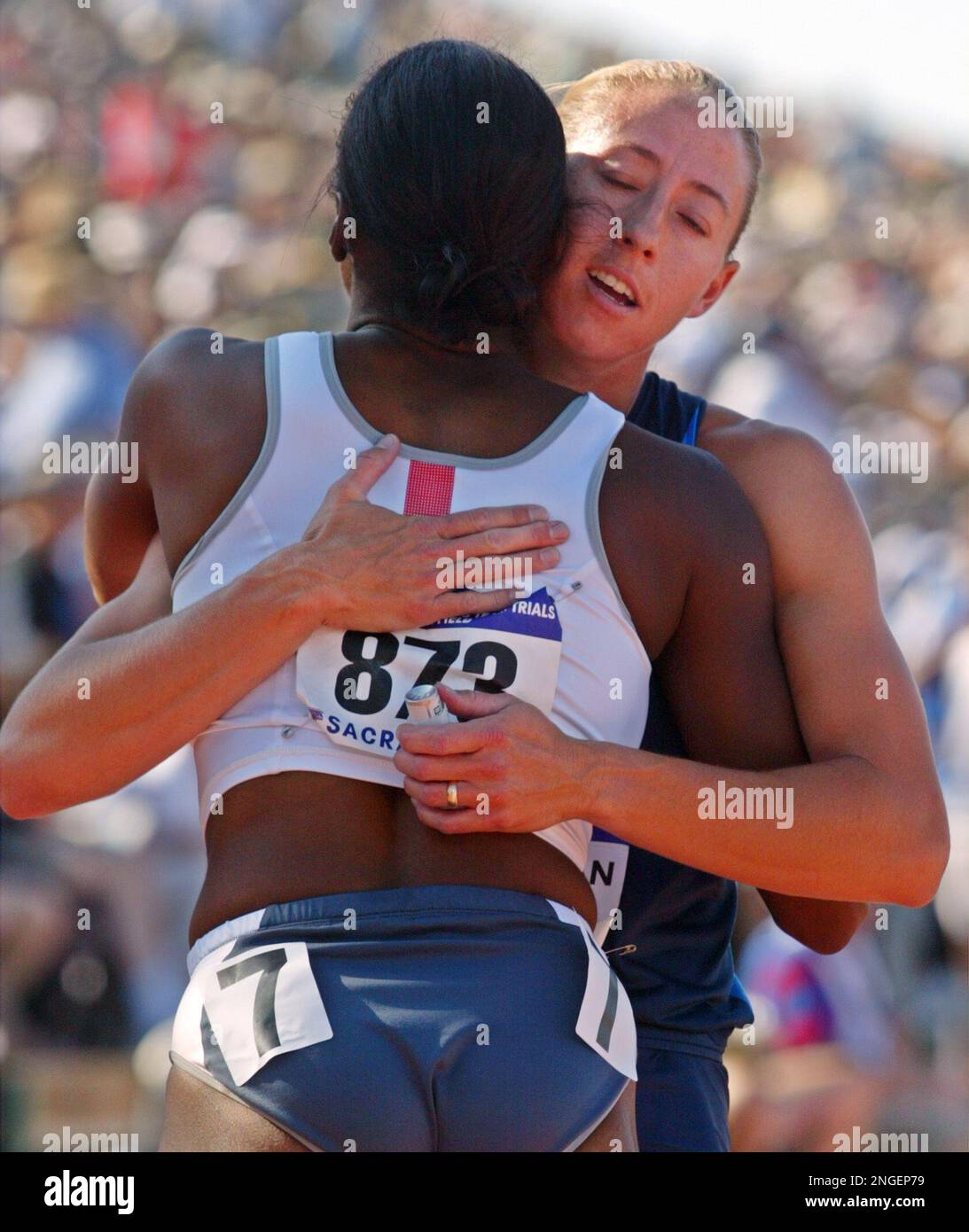 Michelle Perry, left, hugs Tiffany Lott-Hogan after they finished the ...