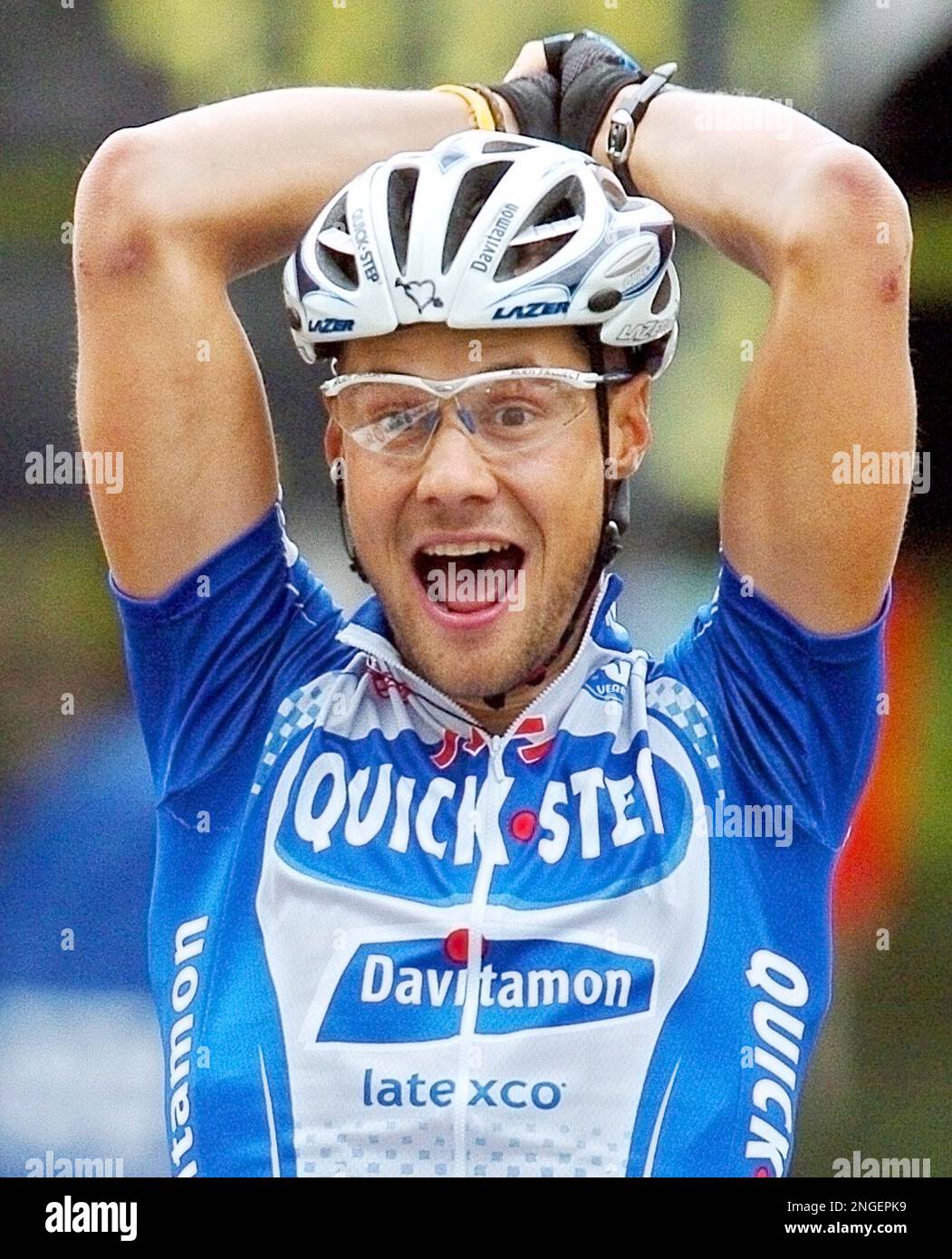 Tom Boonen of Belgium reacts as he crosses the finish line, winning the ...