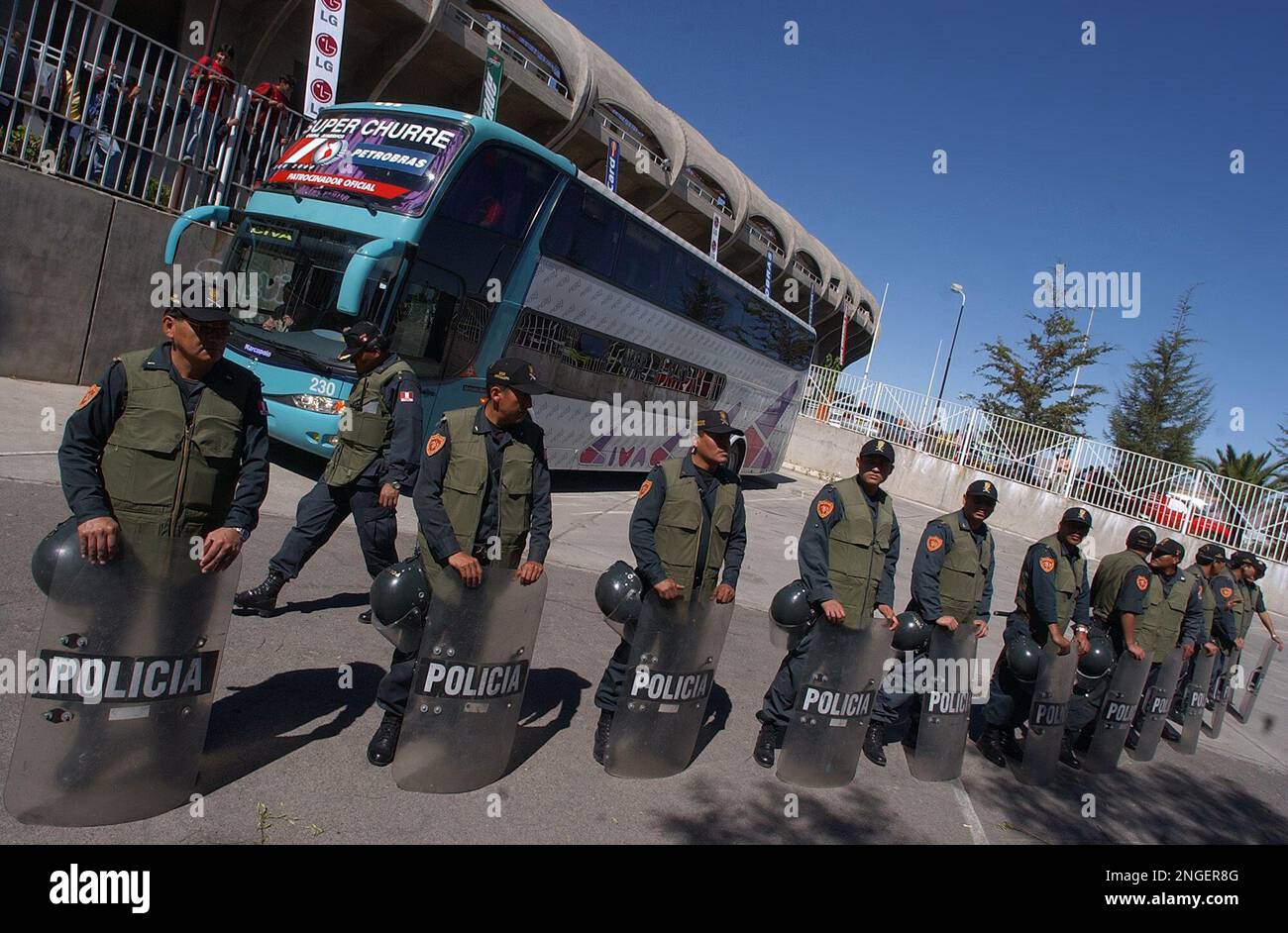 Peruvian riot police stand in front of the University stadium in the ...