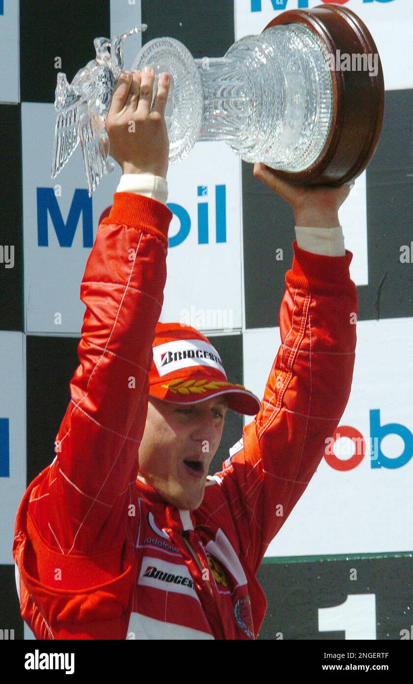 German world champion Michael Schumacher shows his trophey after ...
