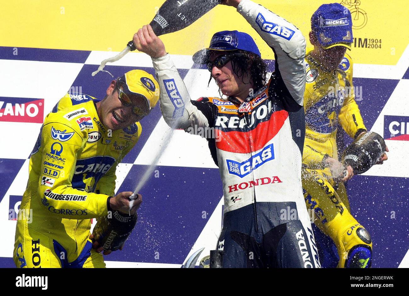 Japanese rider Makoto Tamada, left, celebrates after winning the 2004 ...