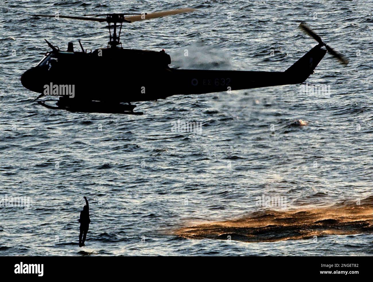A Greek army special forces soldier jumps from a helicopter during an ...