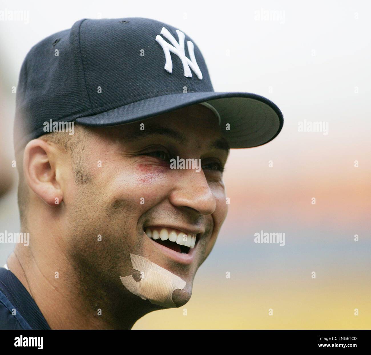 New York Yankees' Derek Jeter looks away as he warms up before a game ...